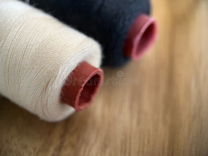 Cotton Thread on Spool for Sewing Material with Wood Background Stock ...