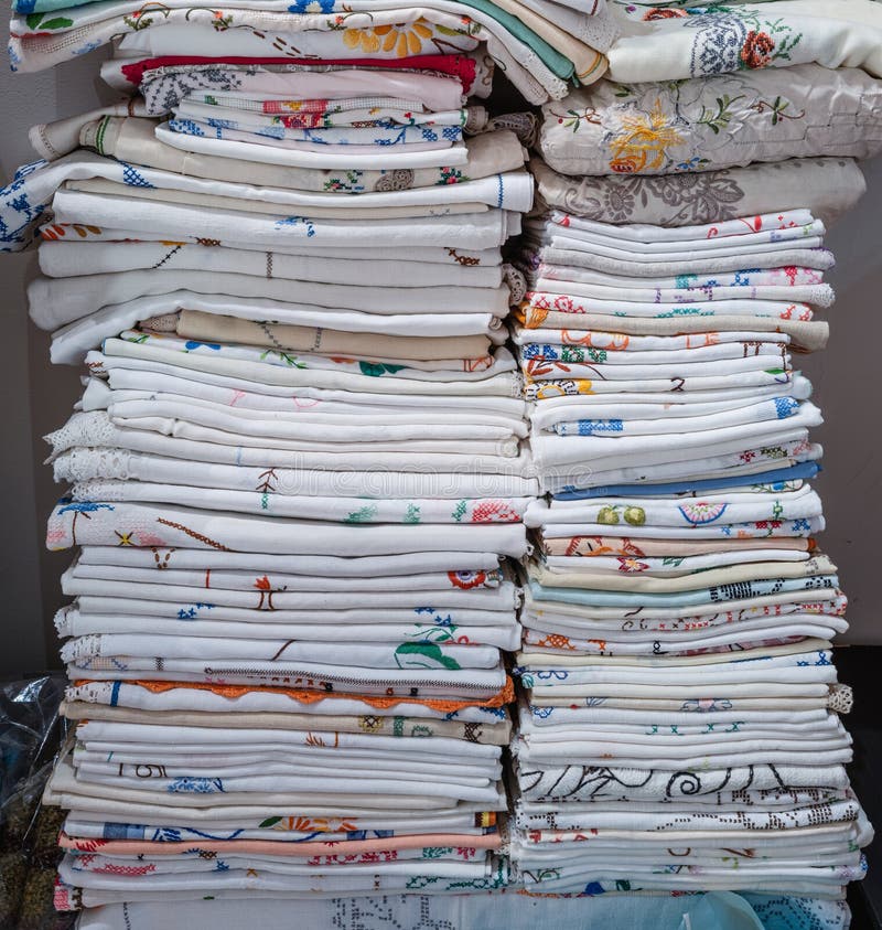 Cotton White Fabrics with Different Patterns are Stacked on a Shelf ...