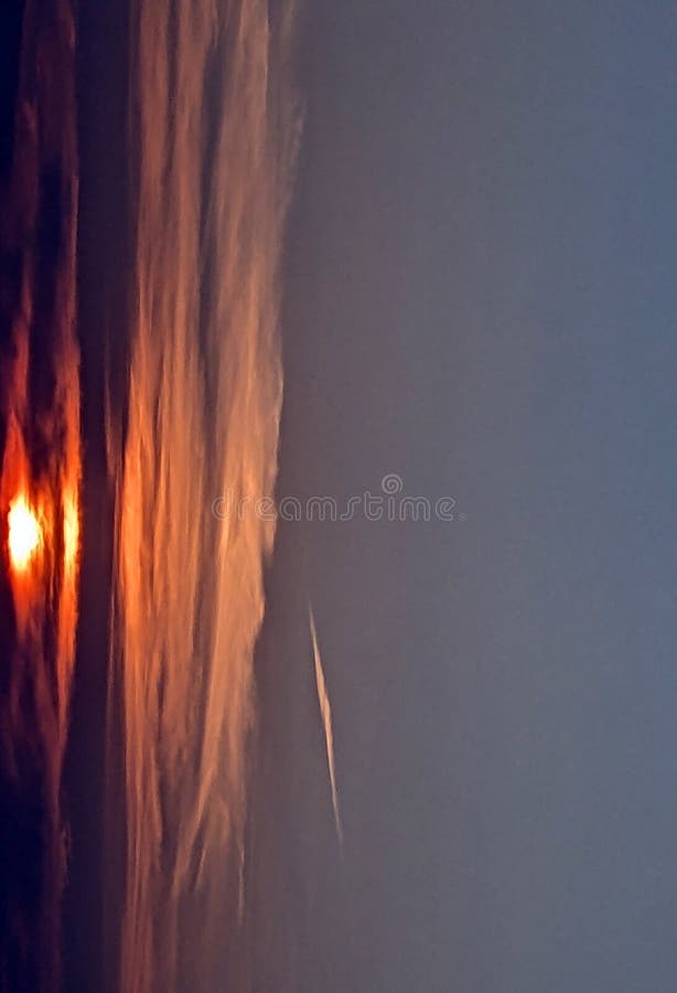 Coudy Sunset in Orange Over a Town with a Clear Sky Stock Image - Image ...