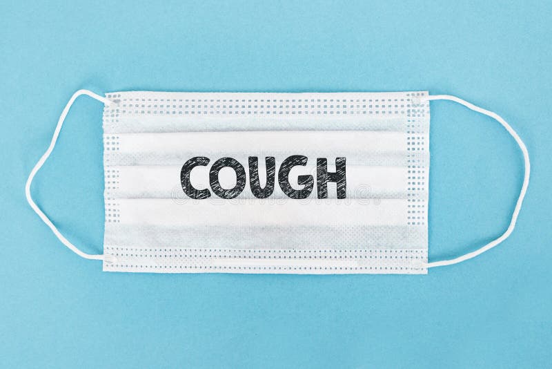 Cough Word Written on a White Medical Mask on Blue Background Stock ...