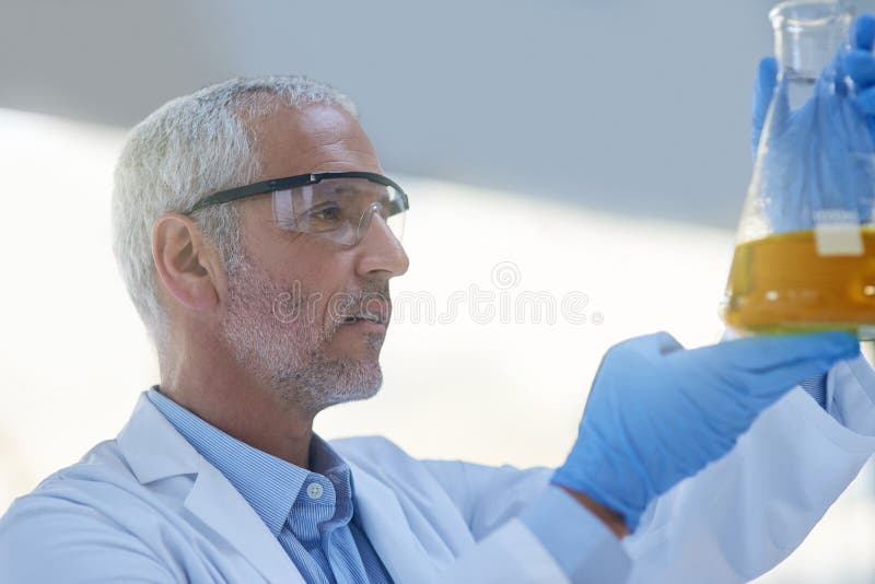 Could this Be the Cure. a Male Scientist Conducting an Experiment in a ...