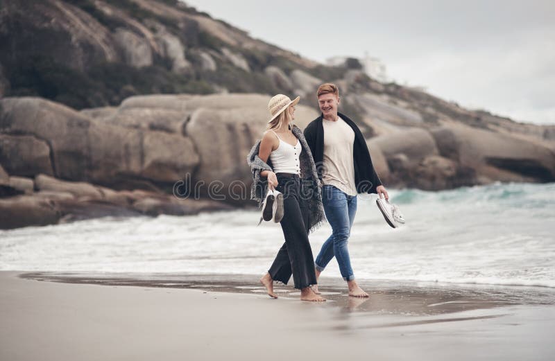 We Could Spend Hours Just Strolling on the Beach. a Couple Holding ...
