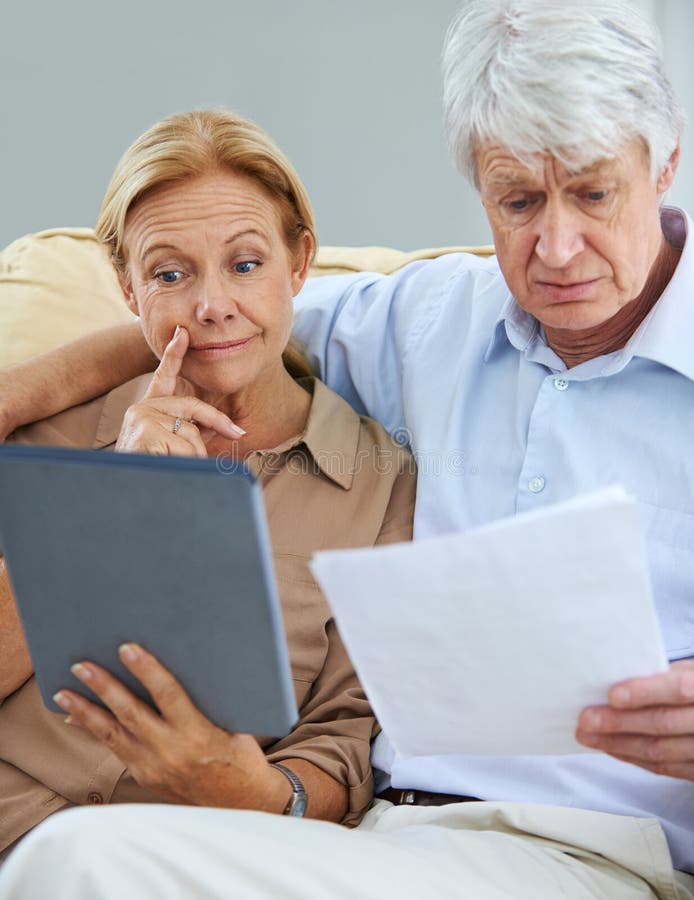 This Could Work...an Elderly Couple Going Over Their Paperwork with the ...
