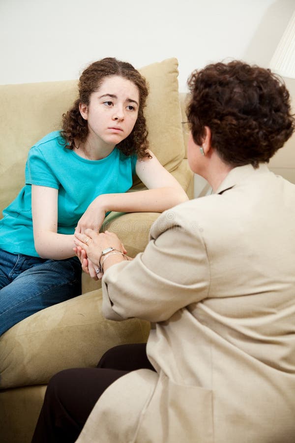 Counselor Comforts Teen stock photo. Image of emotion - 9896924
