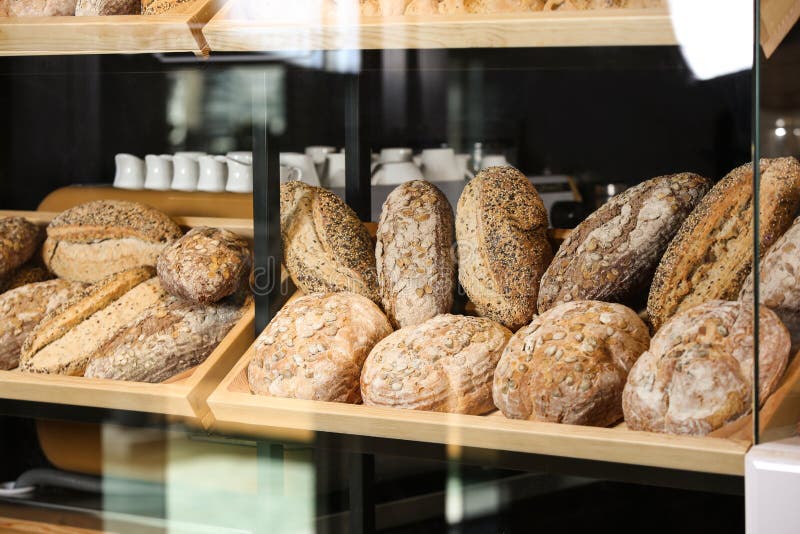 Counter with Assorted Fresh Bread in Bakery Stock Photo - Image of ...