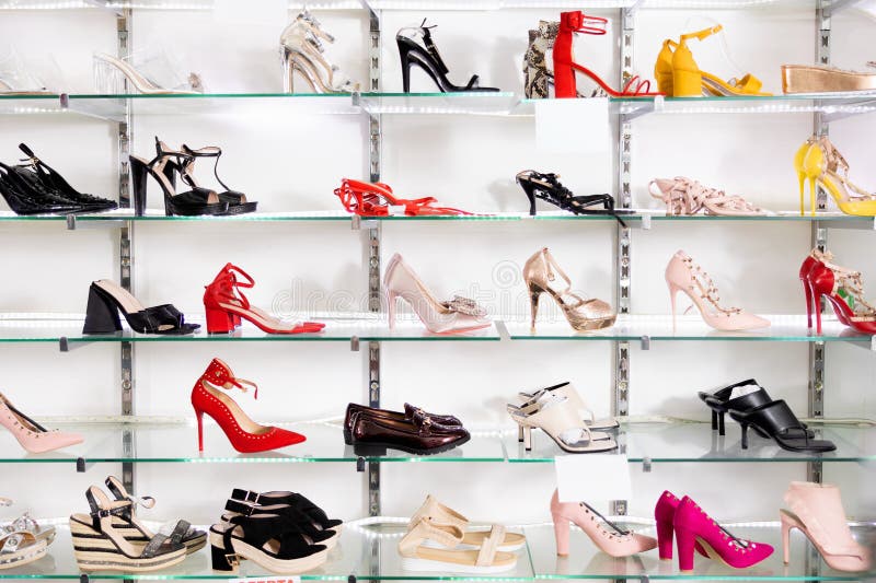 Counter with Stylish High Heeled Shoes in Modern Store Stock Photo ...