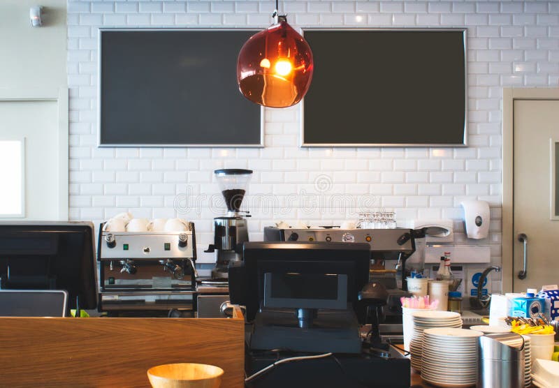 Counter Top at a Bright Cafe with Empty Blackboards on the Wall for ...