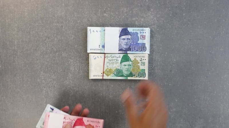 Counting Bundles of Pakistani Rupees Notes Stock Footage - Video of ...