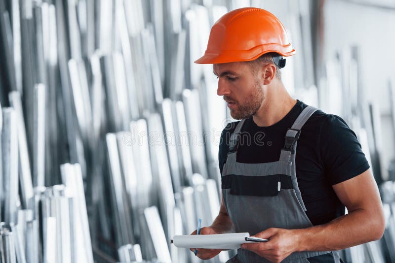 Counting and Checking Objects in the Storage. Industrial Worker Indoors ...