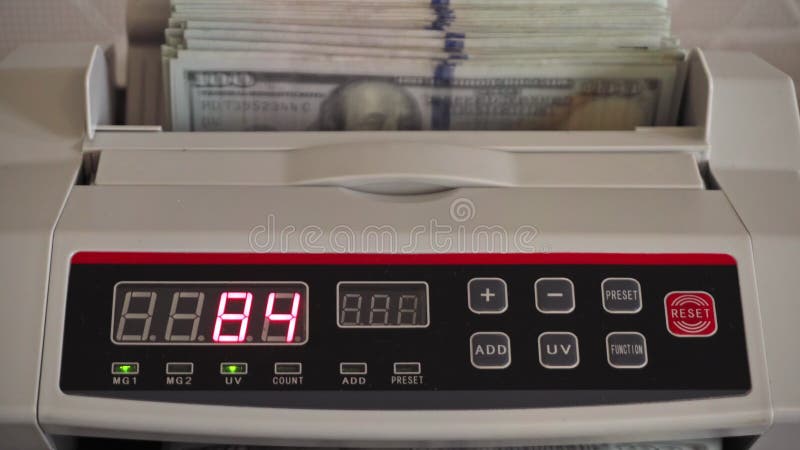 Counting Large Stack of Cash with a Money Counter Machine Stock Video ...