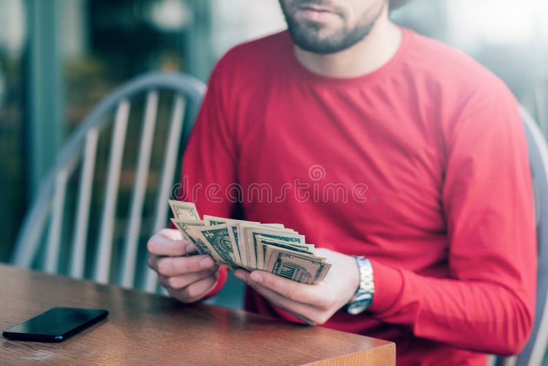 Counting money in a cafe stock photo. Image of dollar - 216549696