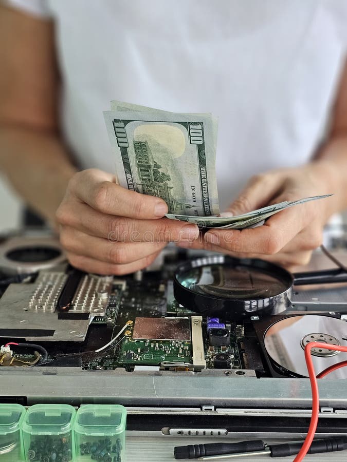 Counting Money while Repairing Computer Components Stock Image - Image ...