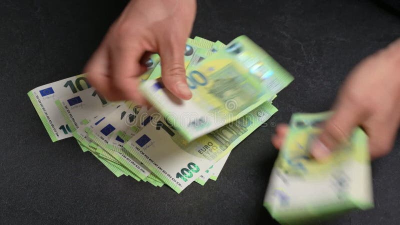 Counting a Stack of 100 Euro Banknotes on a Table Stock Footage - Video ...