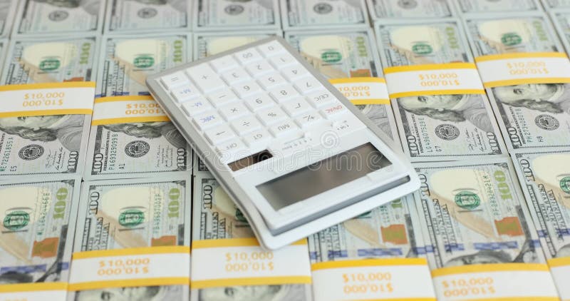 Counting Stacks of Hundred Dollar Bills Using Calculator Stock Video ...