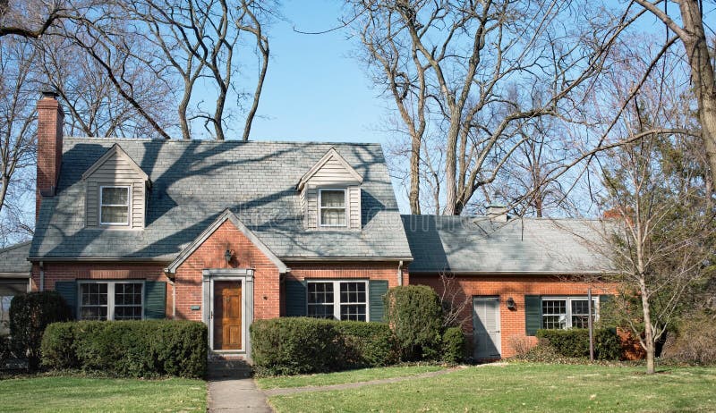 Cape Cod House with Three Dormers & Red Door Stock Photo - Image of ...
