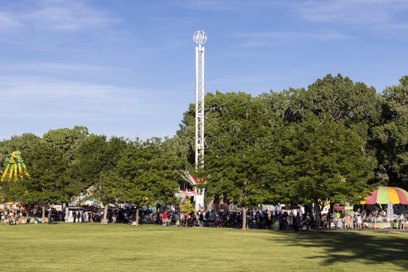 Country Fair Set Up Beyond a Field in a Park Stock Photo - Image of ...