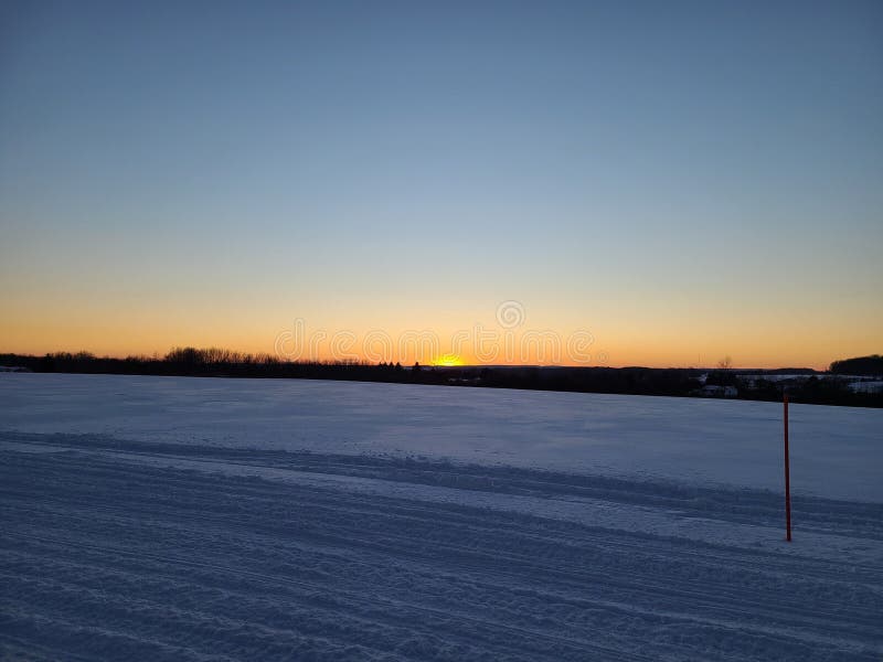 Country Landscape with a Snowy Trail at Sunset Stock Photo - Image of ...
