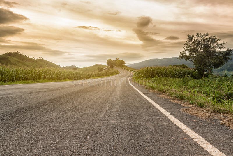 Country Road in the Evening Stock Image - Image of clouds, sunrise ...