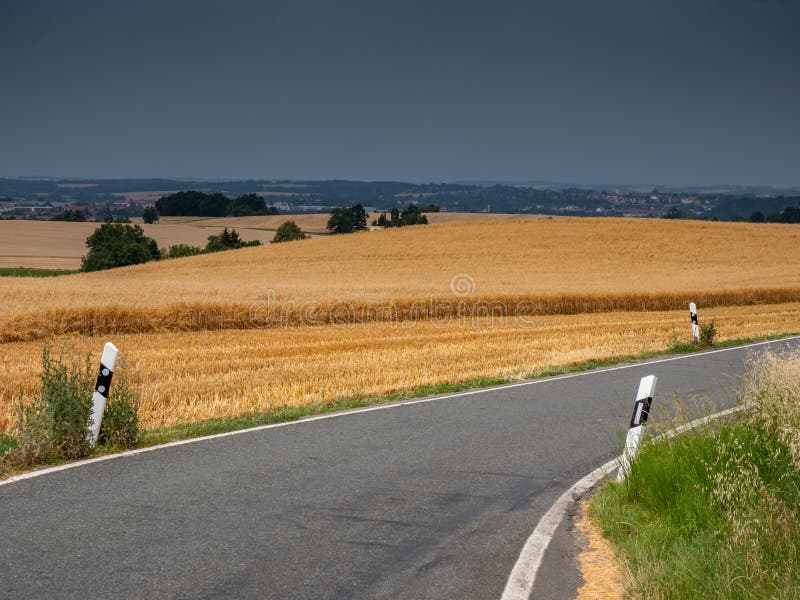 Country road in the field stock photo. Image of dark - 193248914