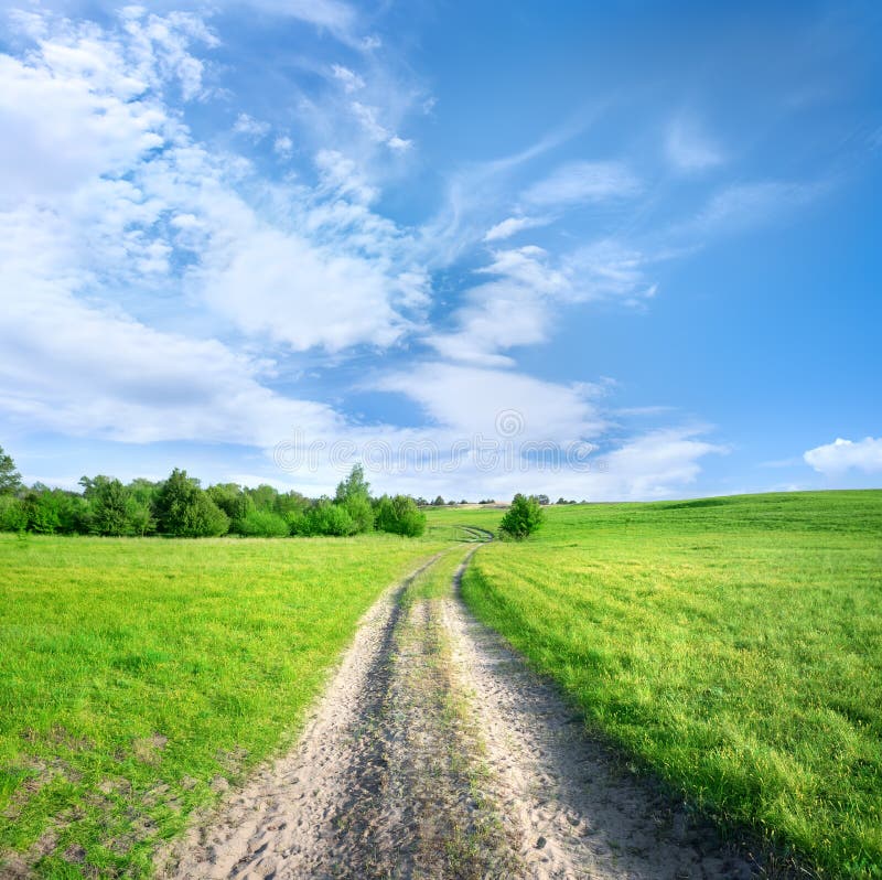 Country road in a field stock image. Image of cloud, hill - 31051153