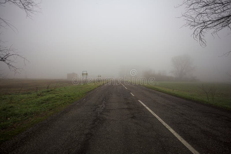 Country road in the fog stock photo. Image of journey - 354509462