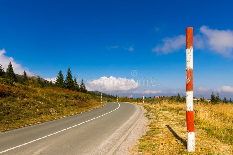 Country Road with a Guide-posts. Stock Photo - Image of scene, green ...