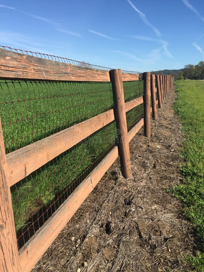 Country road ranch fence stock image. Image of country - 76212337