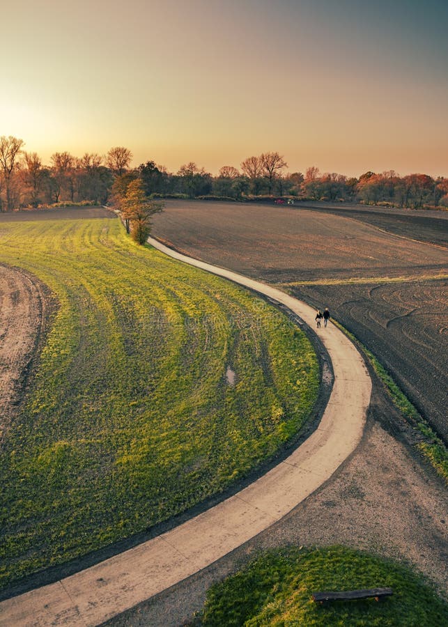 Country Road Running through Fields Stock Photo - Image of walk, field ...