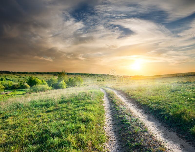 Country road at sunset stock image. Image of land, lawn - 38928047