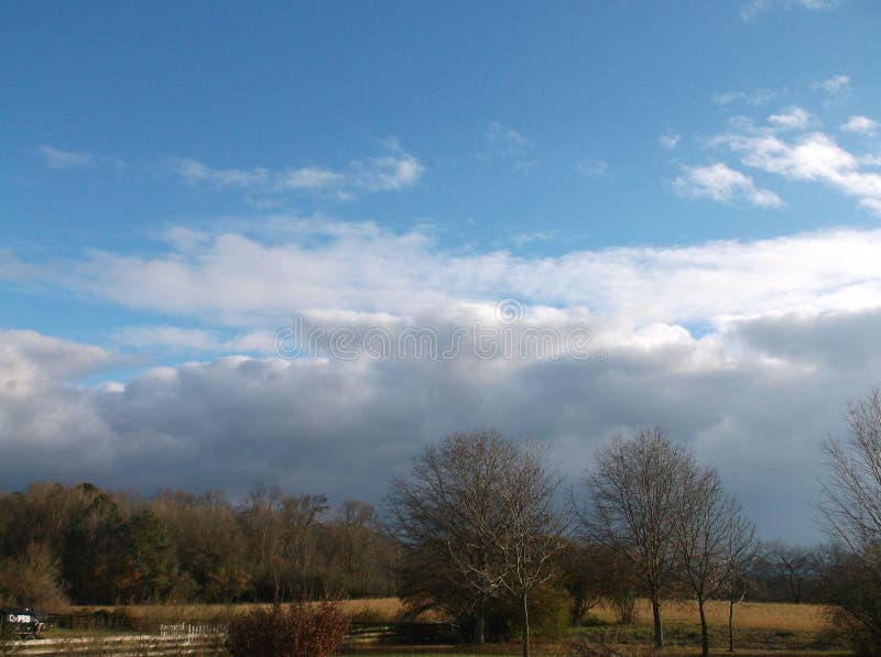 A Country Setting with Blue Skies and White Clouds. Stock Image - Image ...