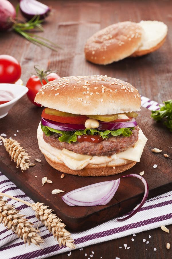 Country Style Cheeseburger. Stock Photo - Image of hamburger, cutting ...
