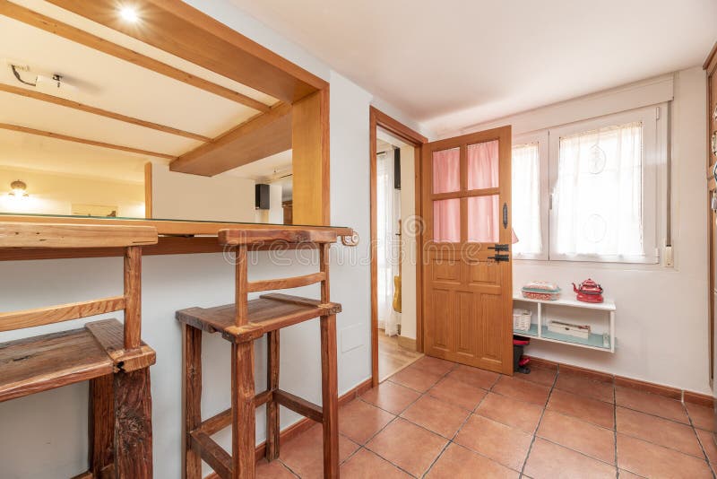 Country-style Kitchen with Serving Hatch with Wooden Bar and High ...