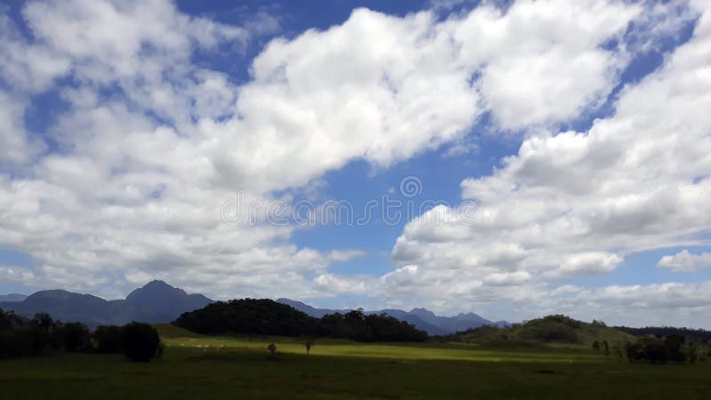 Countryside, Bucolic Place, Mountains, Trees, Clouds and Blue Sky Stock ...