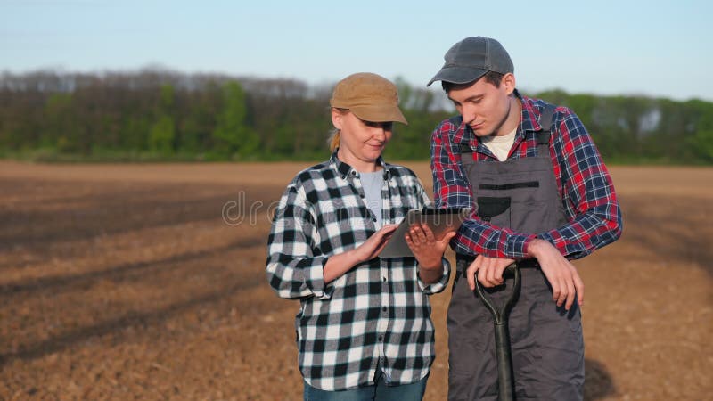 In the Countryside, Two Workers are Optimizing Their Farming Tasks with ...