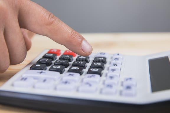 Counts on a calculator stock photo. Image of desk, accounting - 215930610