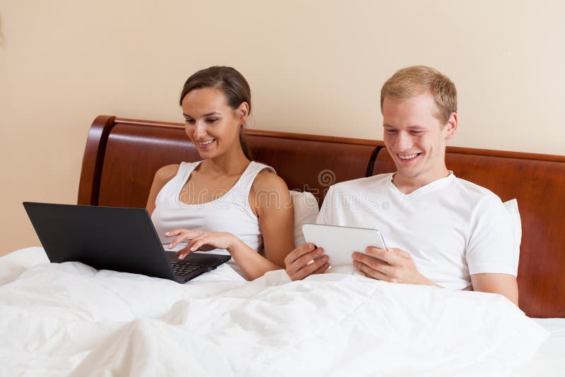 Couple Addicted To Internet Stock Photo - Image of computer, relax ...