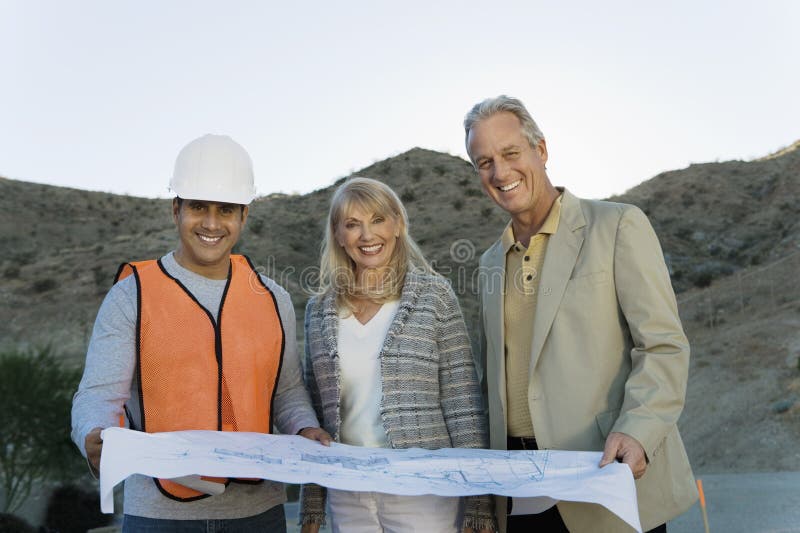 Couple with Architect at Construction Site Stock Photo - Image of ...