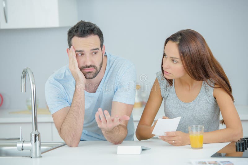 Couple arguing in kitchen stock photo. Image of female - 101441242