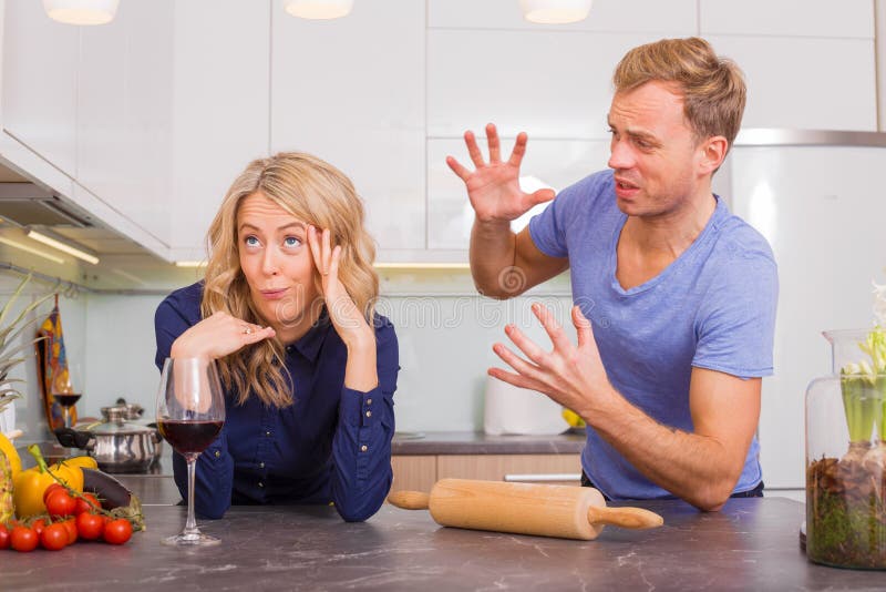 Couple arguing in kitchen stock photo. Image of indoors - 69034988