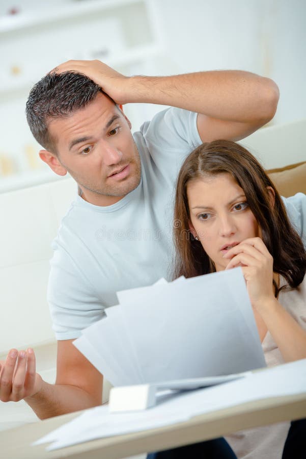 Couple arguing over bills stock image. Image of fight - 124017975