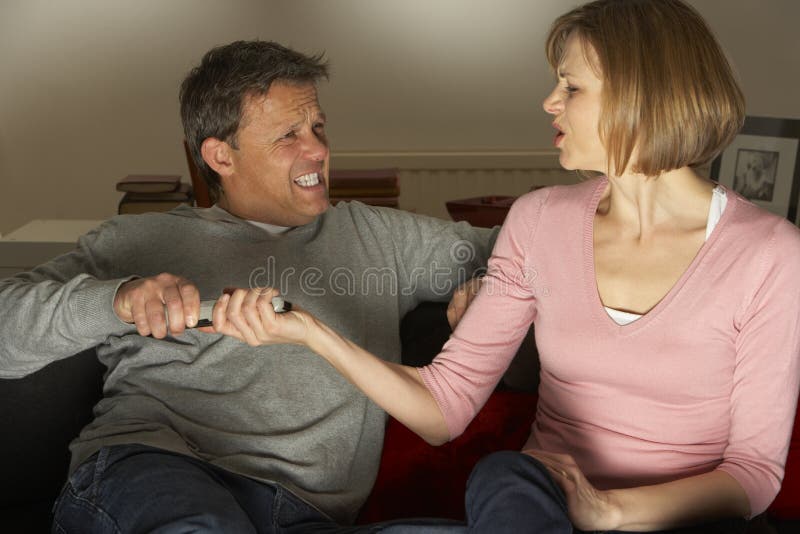 Couple Arguing Over Television Channel Stock Photo - Image of family ...