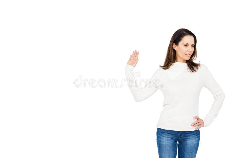 Mature Woman Raising Right Hand Outward, Resting Left Arm on Hip in ...