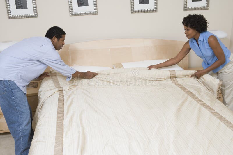Woman Preparing Bed at Home Stock Photo - Image of middle, person: 29651578