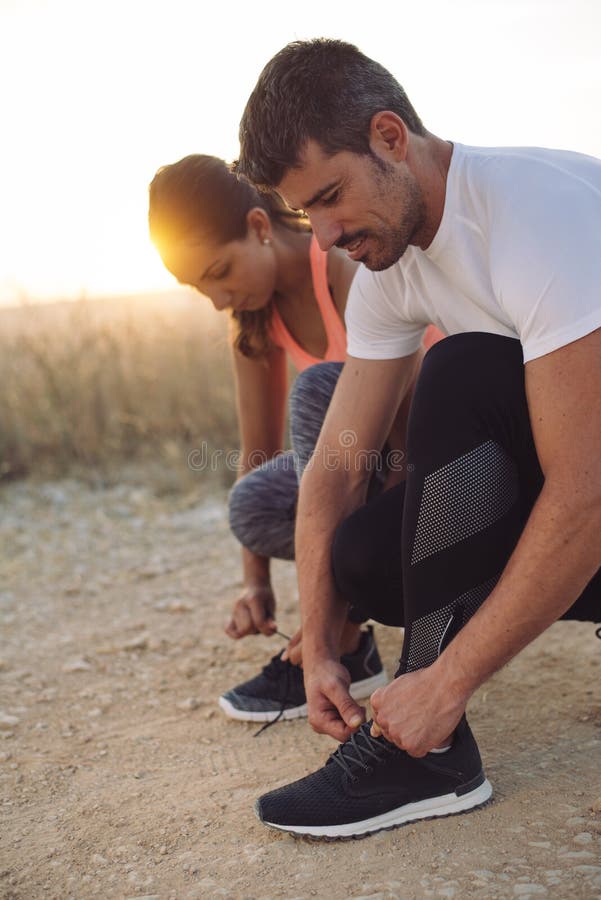 Couple of Athletes Getting Ready for Running Stock Image - Image of ...