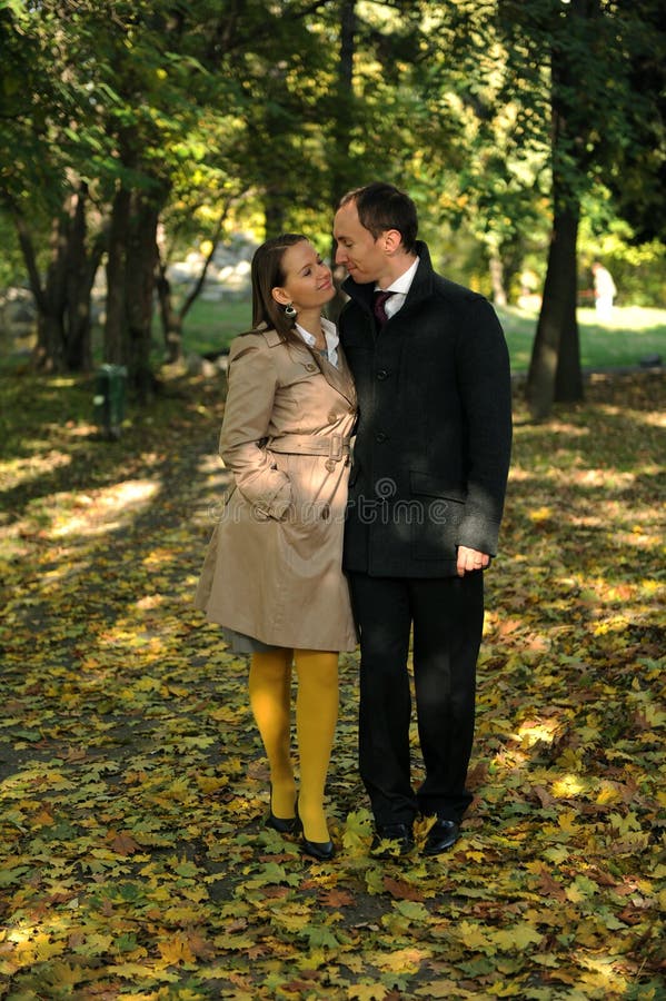 Couple in autumn landscape stock photo. Image of holiday - 12026252