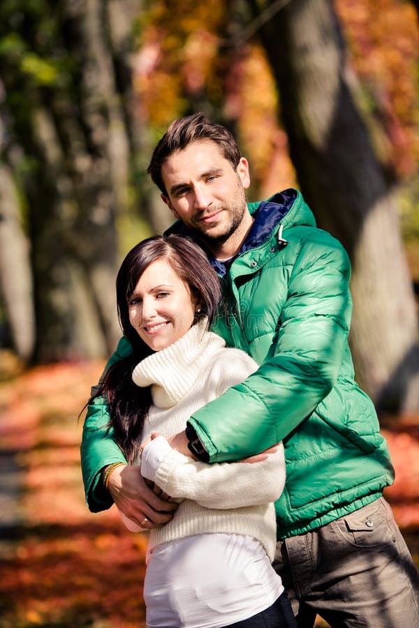 Couple in the autumn park stock photo. Image of outdoor - 27513068