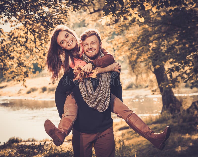 Couple in autumn park stock image. Image of colourful - 59702349
