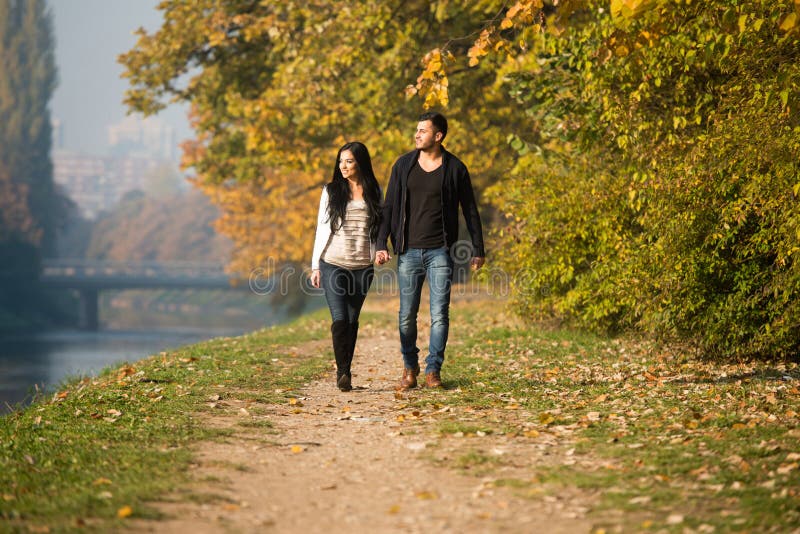 Couple in Autumn Park stock image. Image of autumn, clothing - 65390829