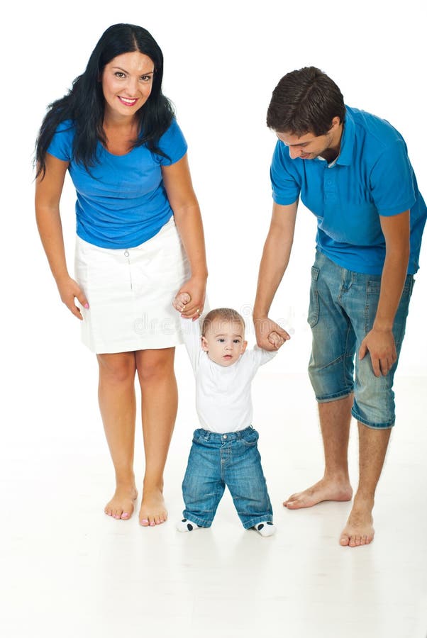 Couple with Baby Making First Steps Stock Photo - Image of casual ...