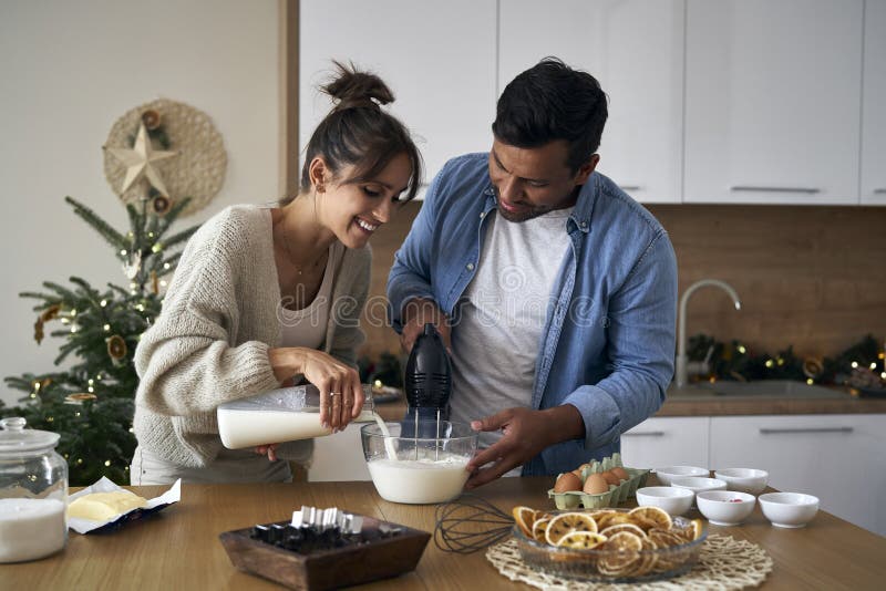 Couple Baking Together during the Christmas Stock Photo - Image of love ...